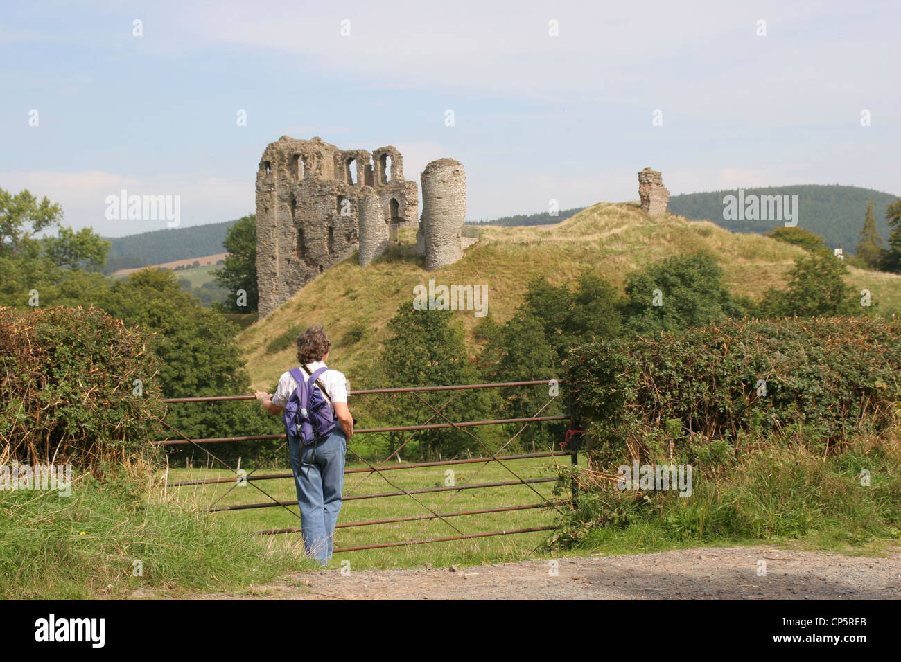 Clun Castle and walker at gate Clun Shropshire England UK Stock Photo ...