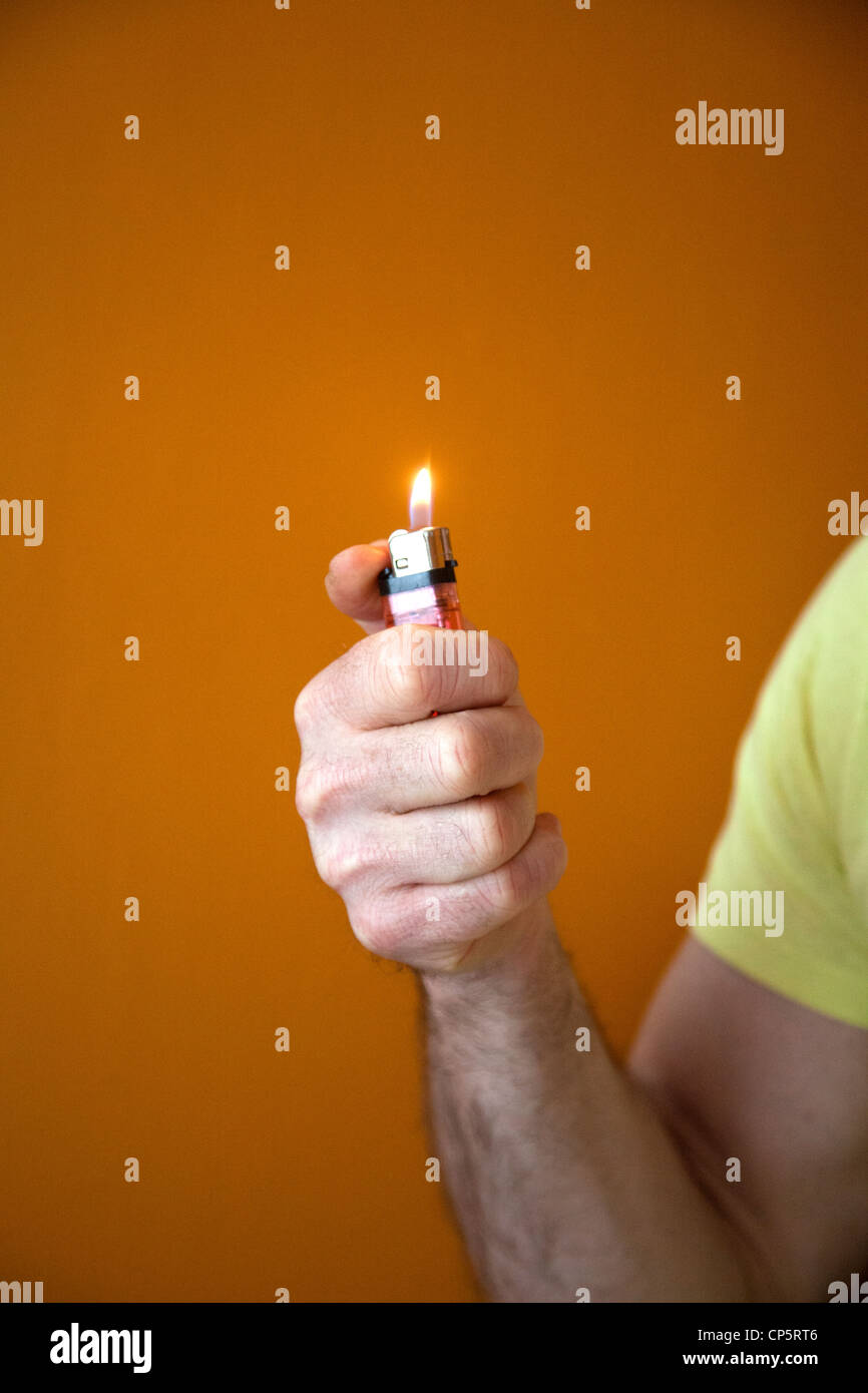 Man holding Lighter Stock Photo - Alamy