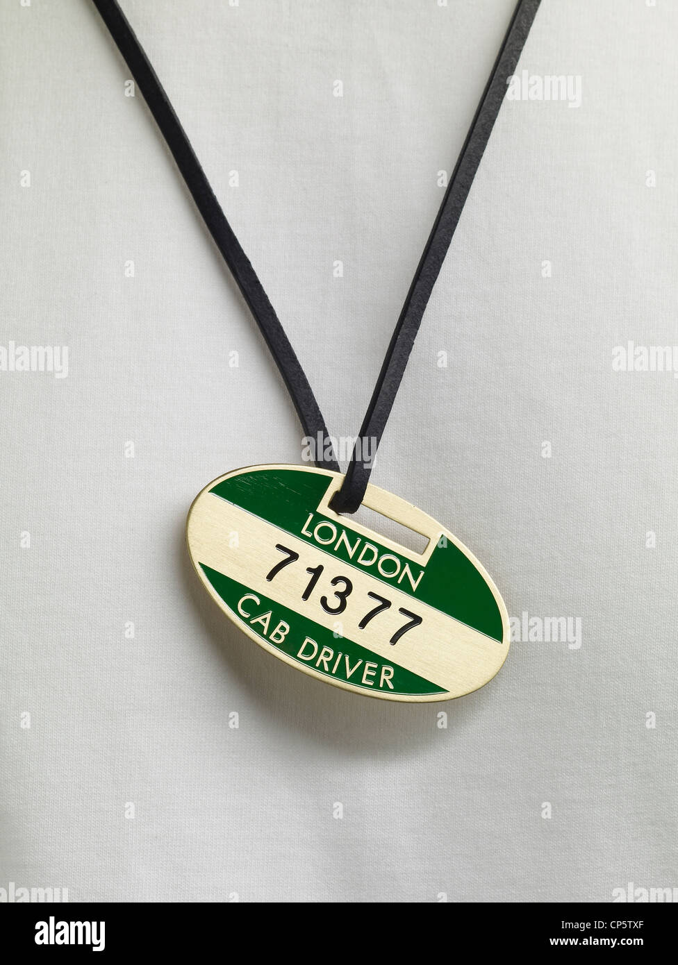 London taxi drivers badge hanging on a leather strap Stock Photo - Alamy