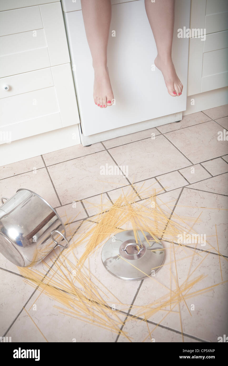 one woman,spaghetti and saucepan on floor Stock Photo - Alamy