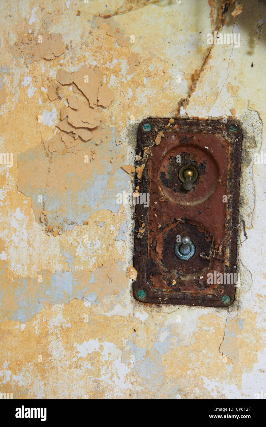 rusted old light switch on a wall of flaky paint Stock Photo - Alamy