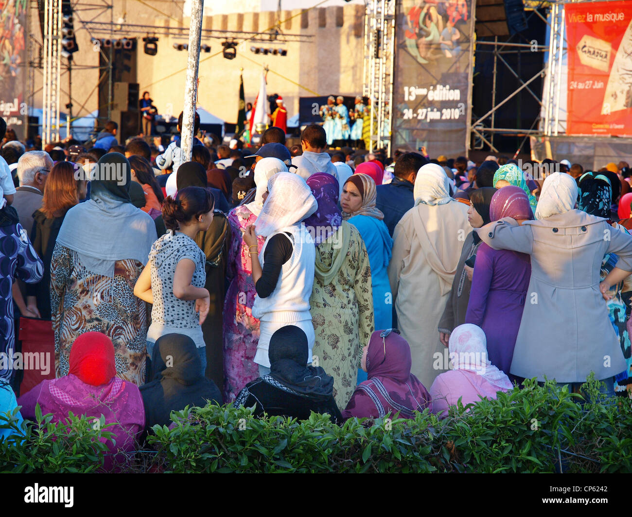 Moroccan women in the crowd at the festival in Essaouira Stock Photo ...