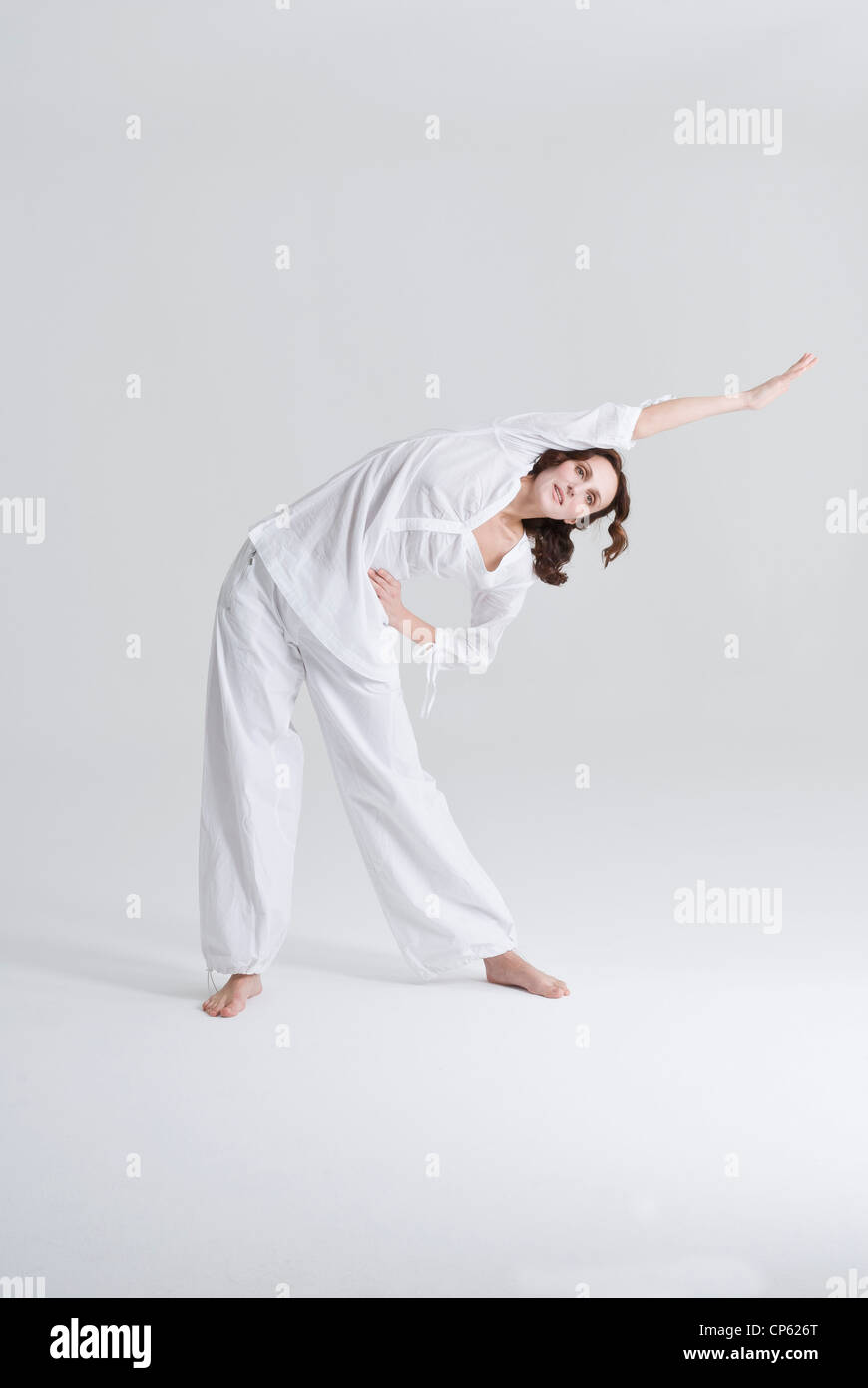 Mid adult woman doing exercise Stock Photo - Alamy