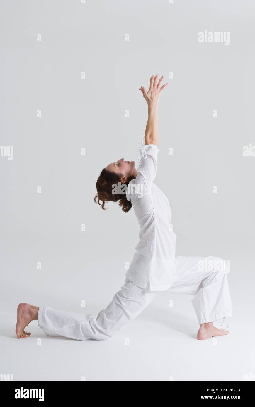 Mid adult woman doing exercise Stock Photo - Alamy
