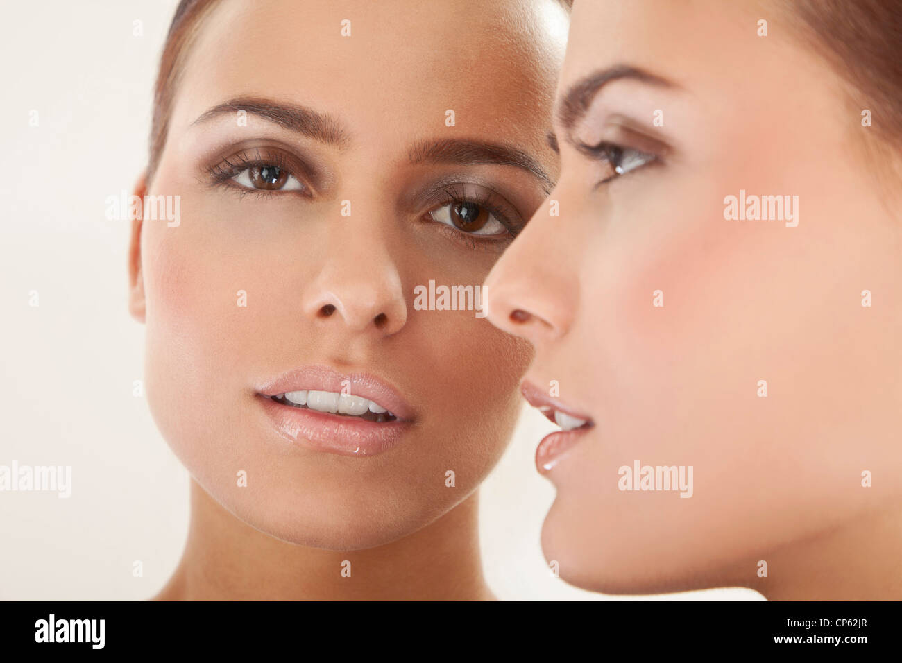 Young woman reflection in mirror, close up Stock Photo - Alamy