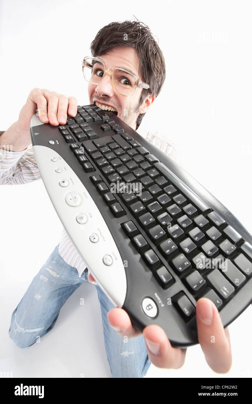 Biting keyboard hi-res stock photography and images - Alamy