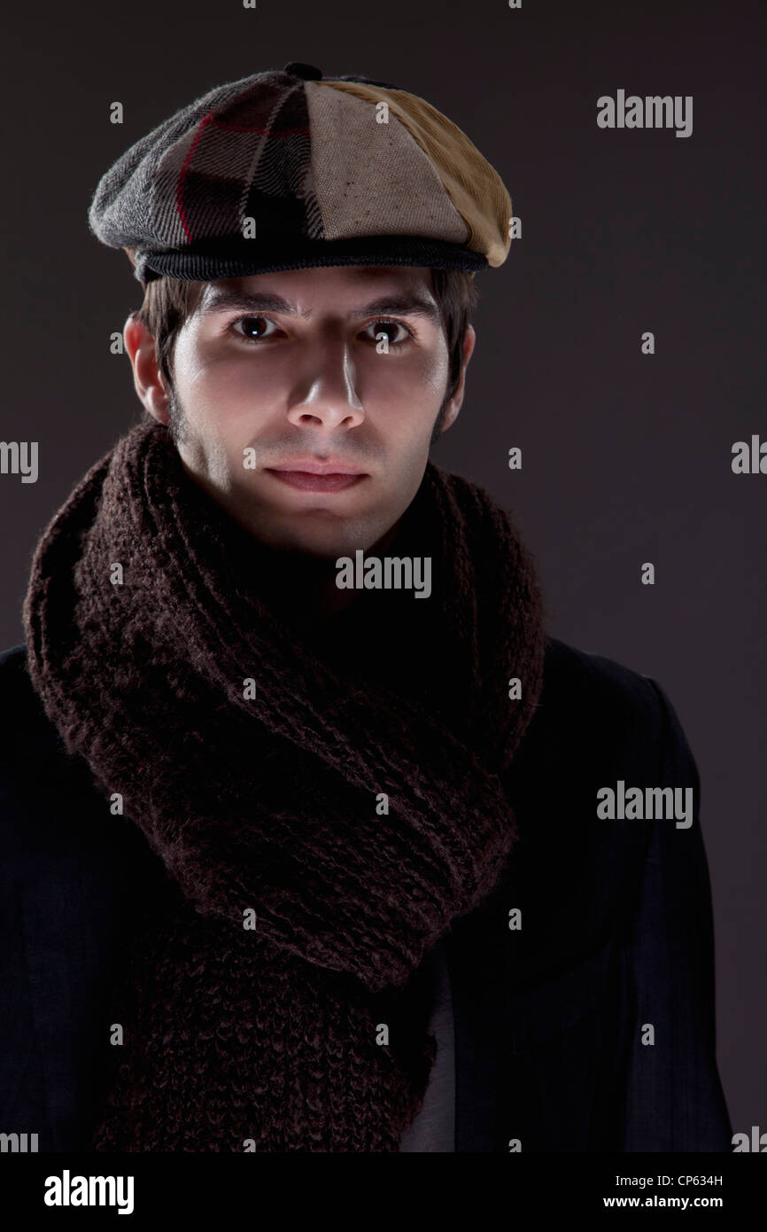 Young man with scarf and cap, portrait Stock Photo - Alamy