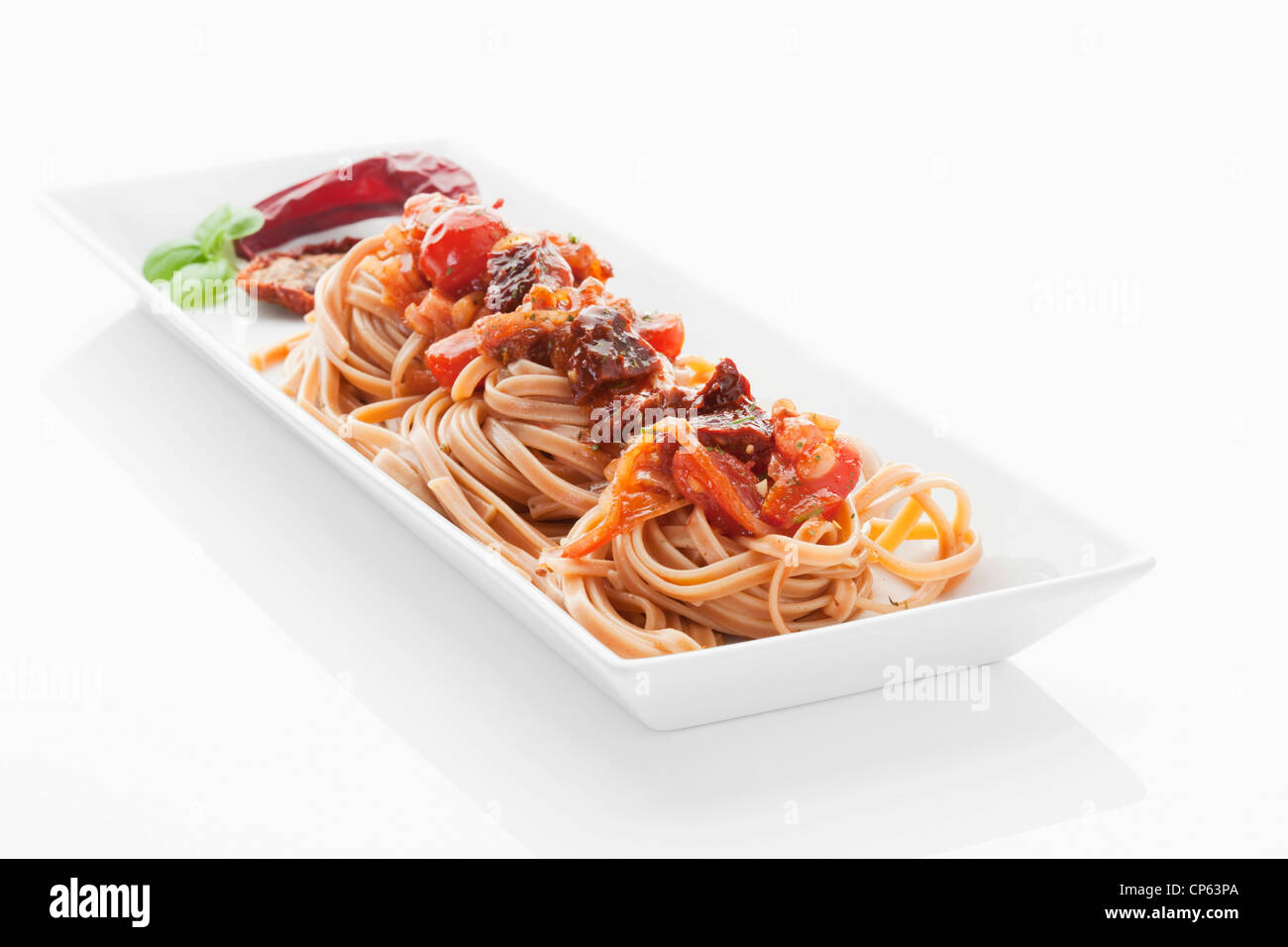 Linguini on white Cut Out Stock Images & Pictures - Alamy