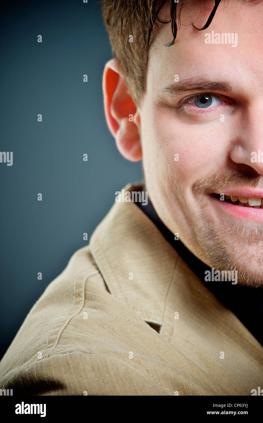 studio shot, portraits, half face, smiling, blue eyes, successful ...