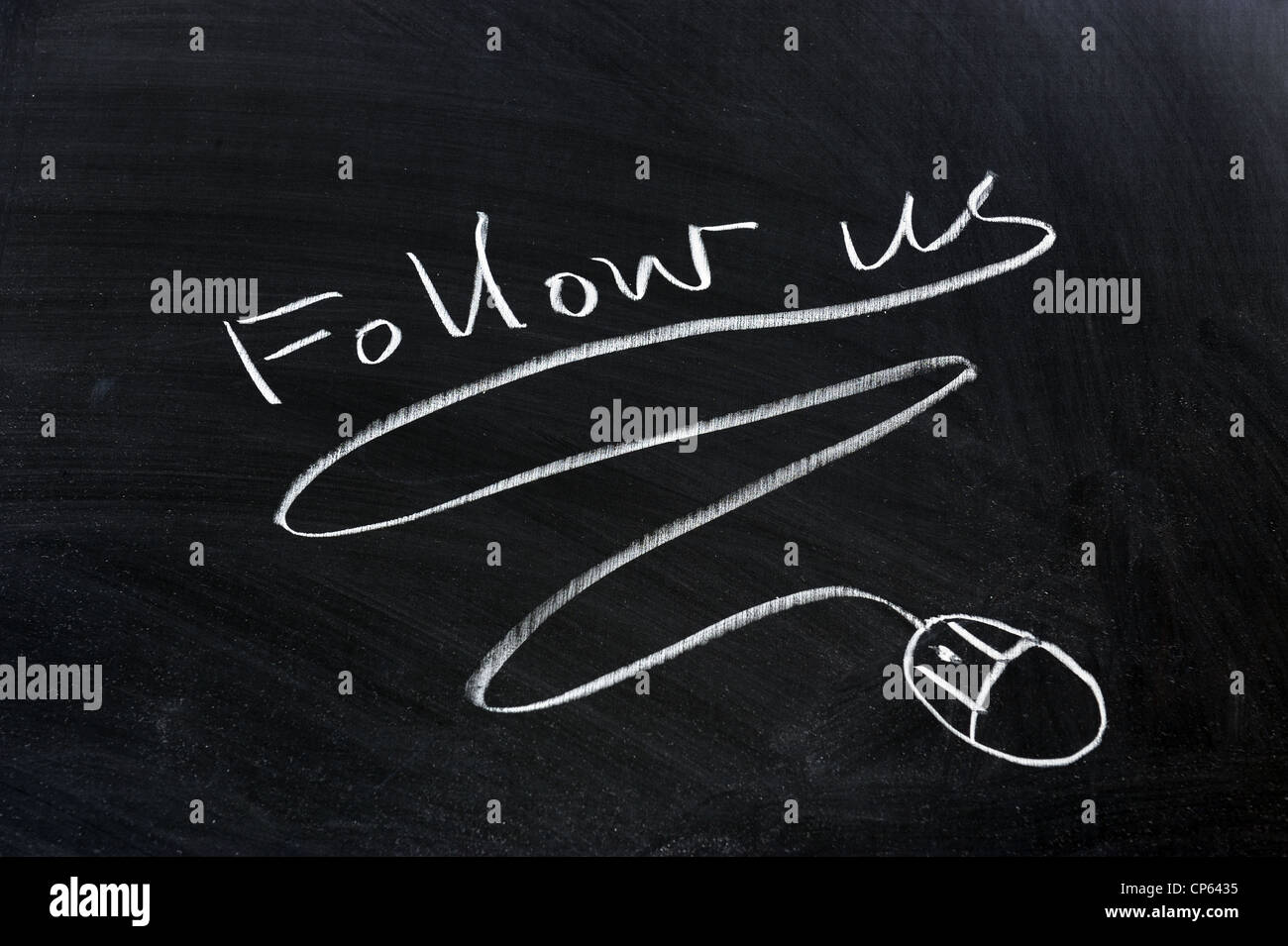 Follow us and mouse drawn on the chalkboard Stock Photo - Alamy