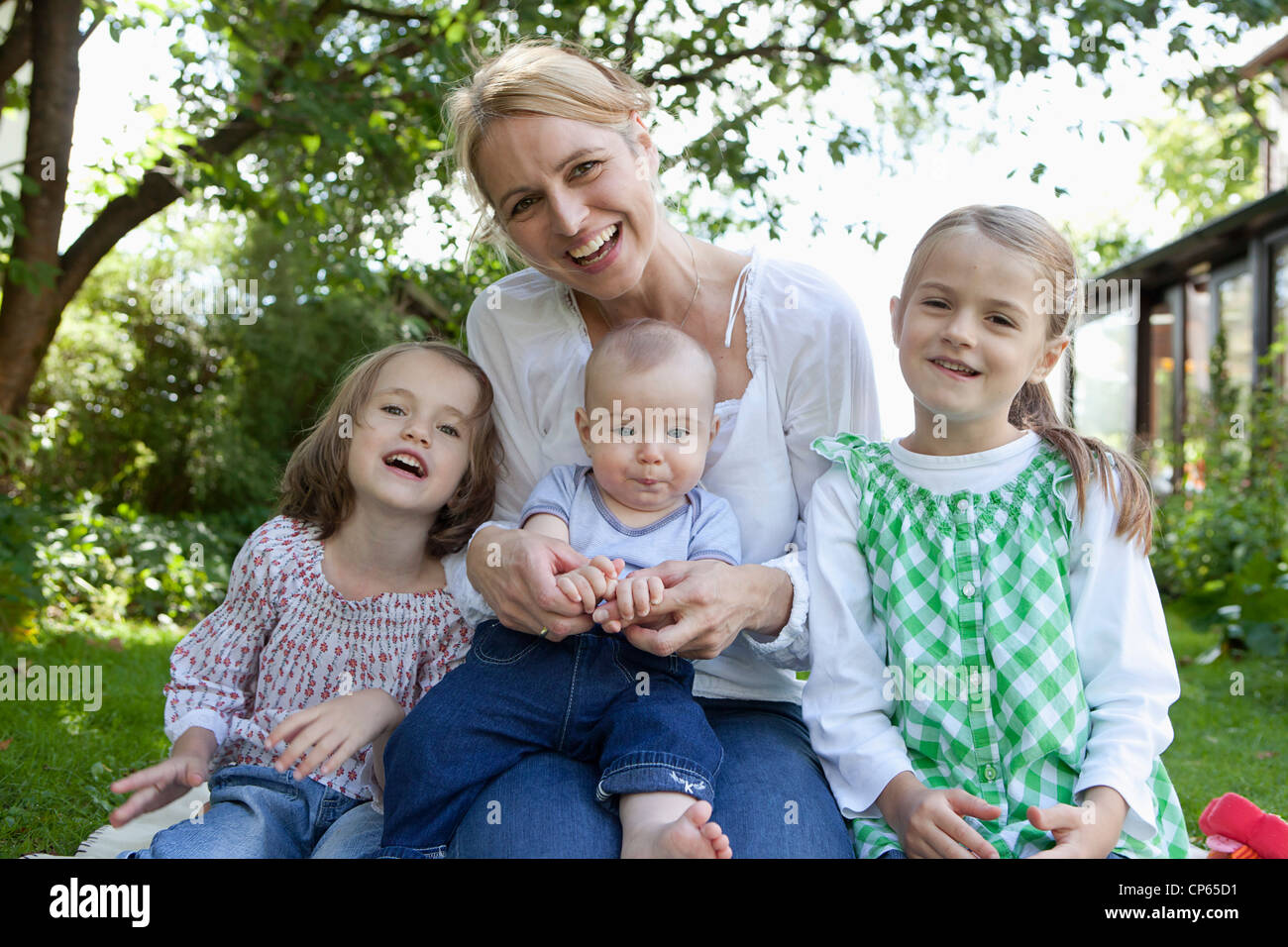 Germany, Bavaria, Munich, Family in garden, smiling Stock Photo - Alamy