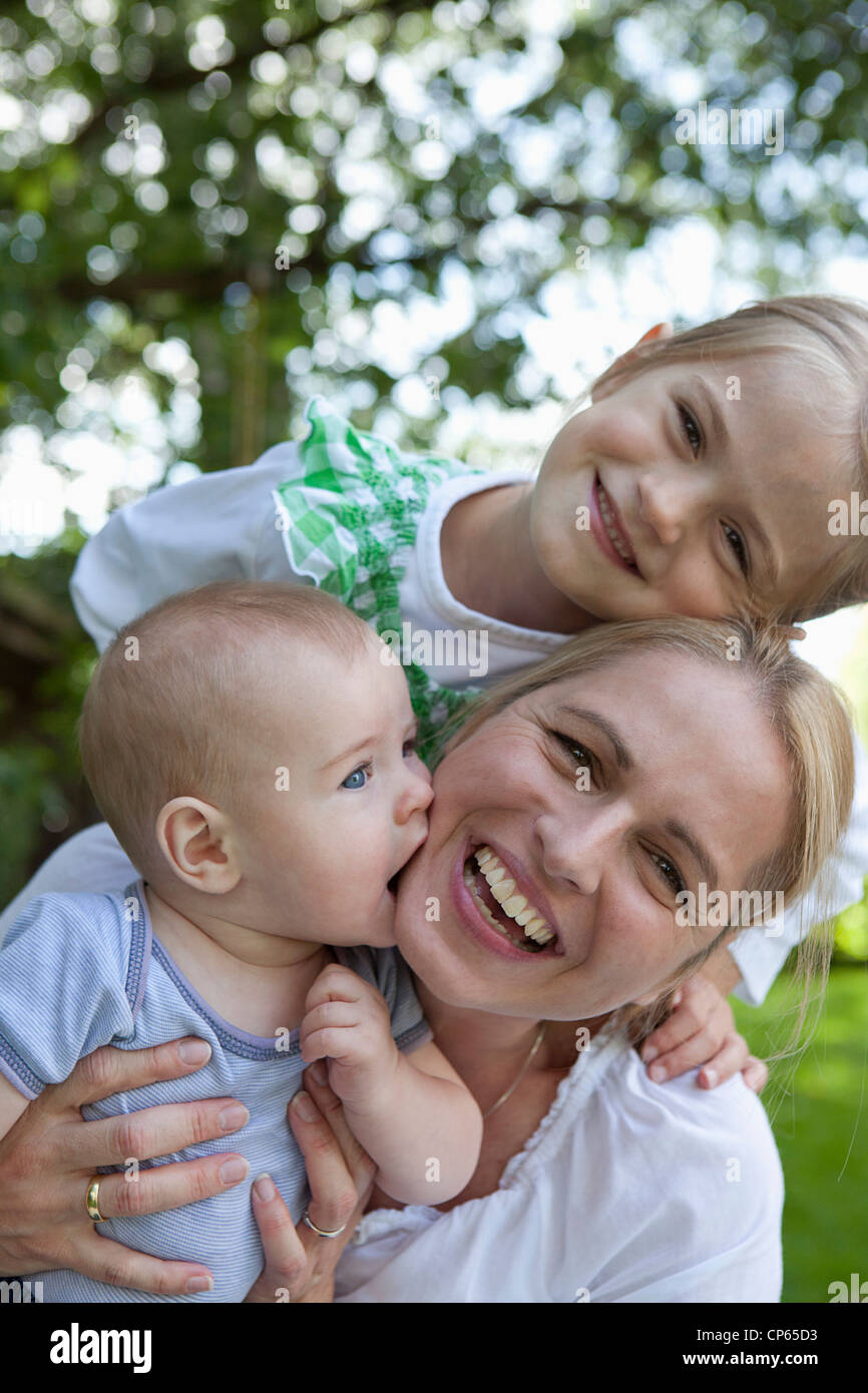 Germany, Bavaria, Munich, Family in garden, smiling Stock Photo - Alamy