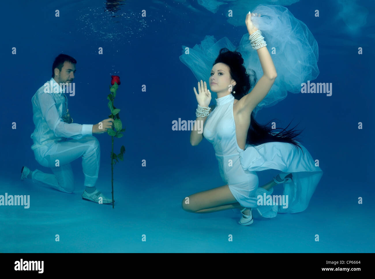 Bride and groom, underwater wedding in a pool Stock Photo - Alamy