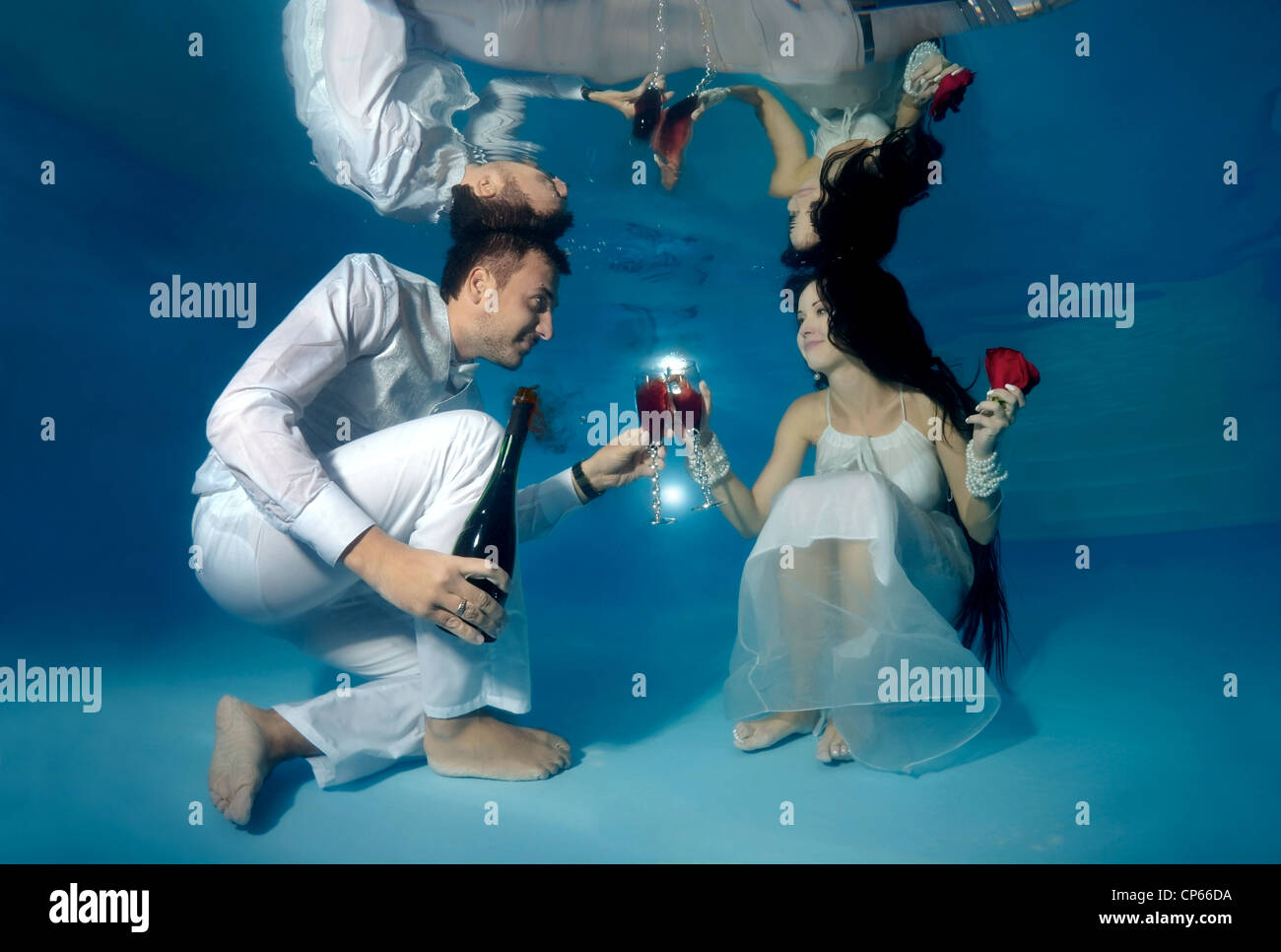 Bride and groom, underwater wedding in a pool Stock Photo - Alamy