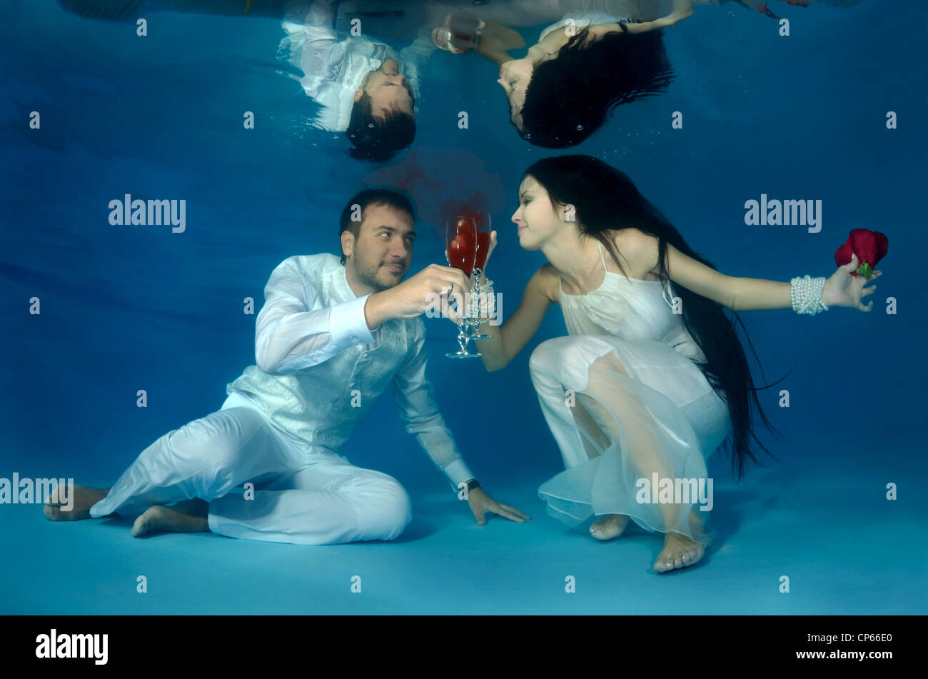 Bride and groom, underwater wedding in a pool Stock Photo - Alamy