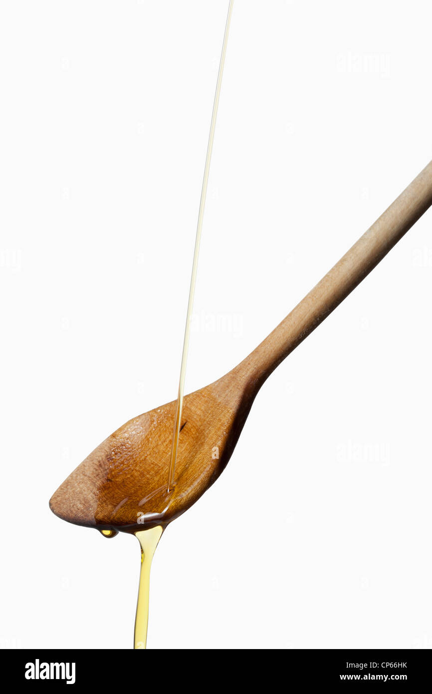Olive oil flowing on spoon hi-res stock photography and images - Alamy