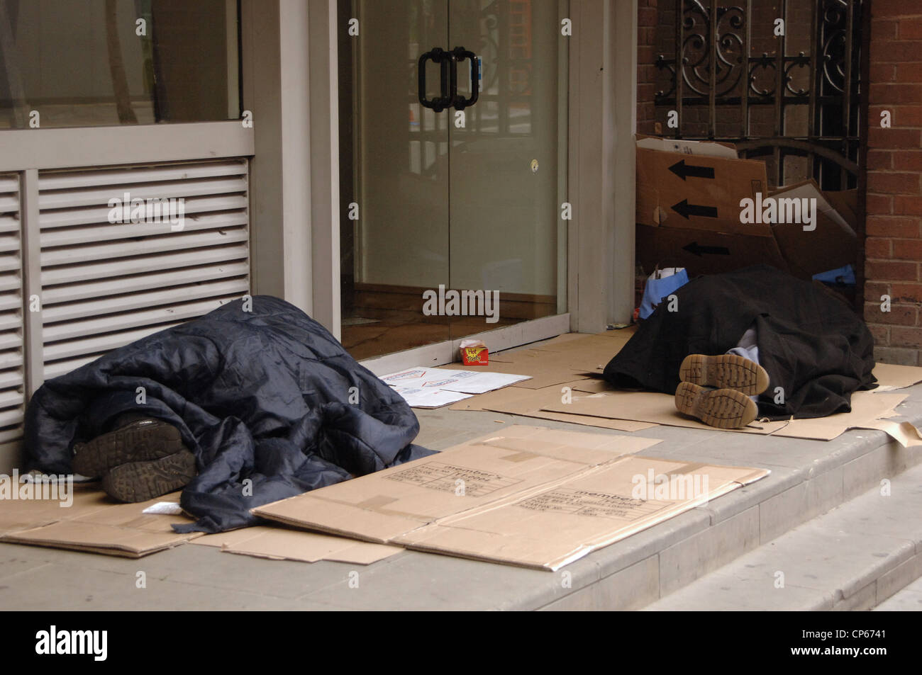 Homeless people sleeping in doorway hi-res stock photography and images ...