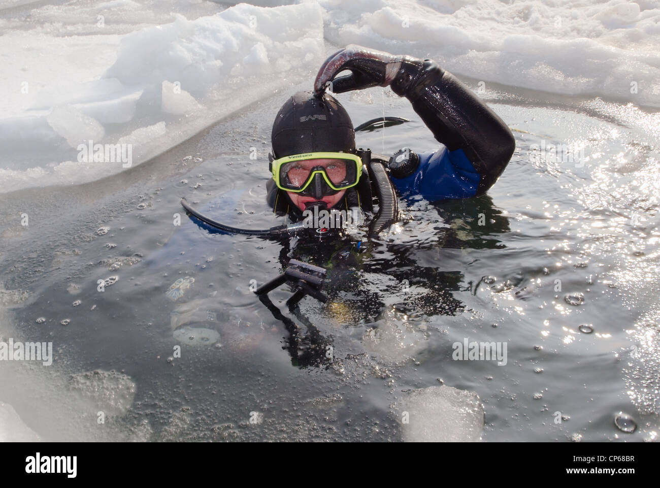 Diver, subglacial diving, ice diving, in the frozen Black Sea, a rare ...