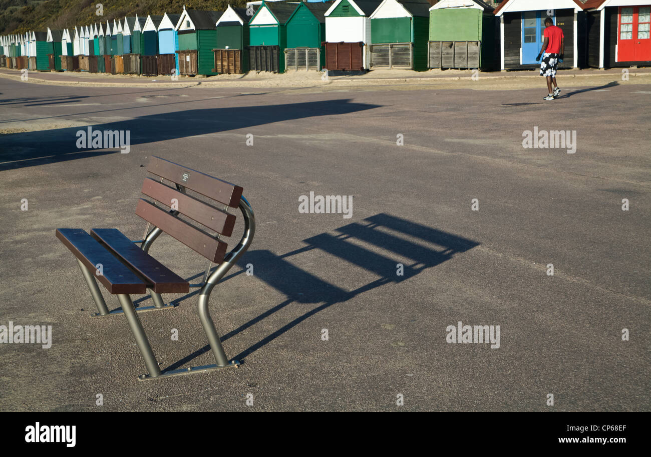 Bench, shadow and beach huts at Bournemouth Stock Photo - Alamy