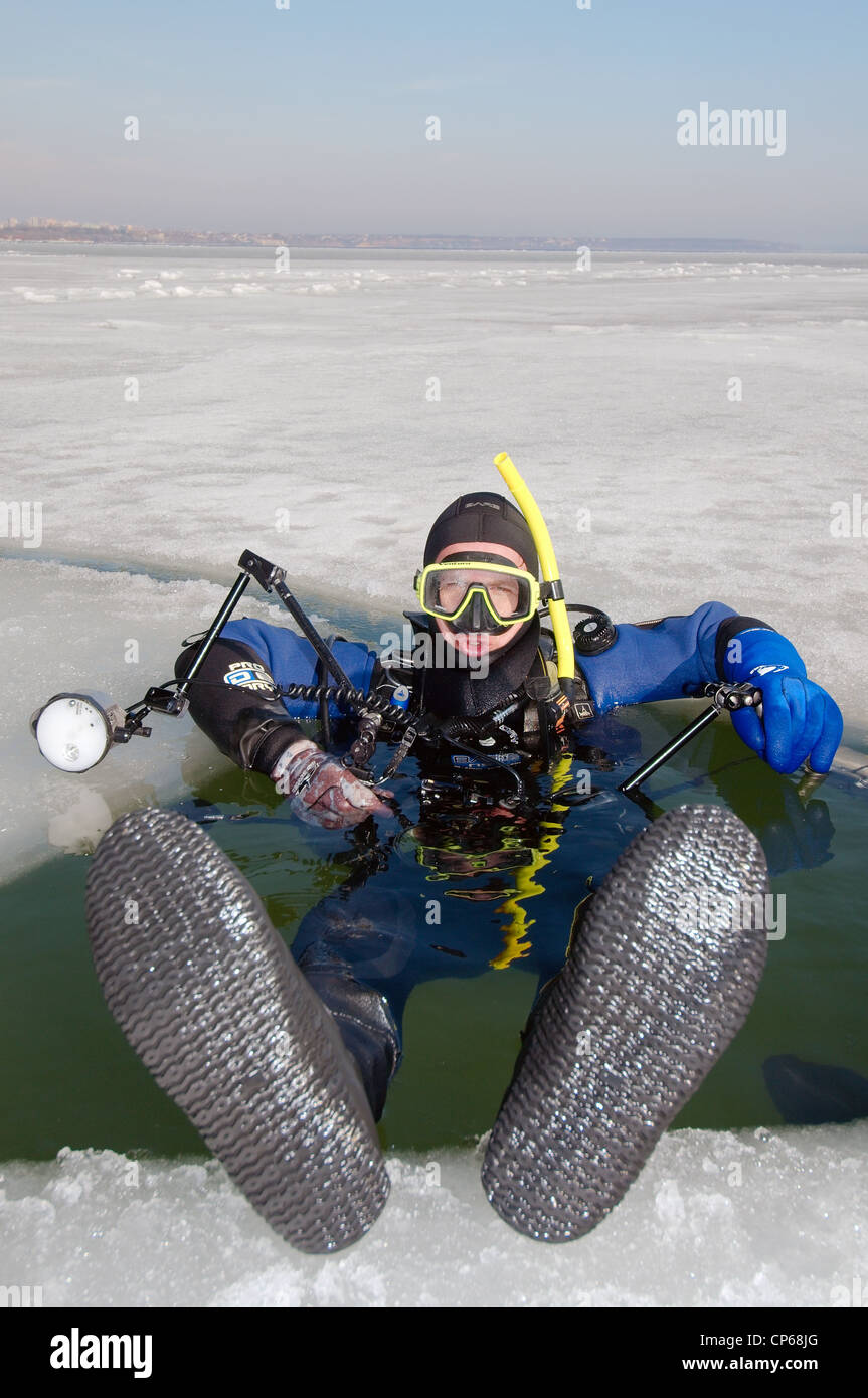 Diver, subglacial diving, ice diving, in the frozen Black Sea, a rare ...