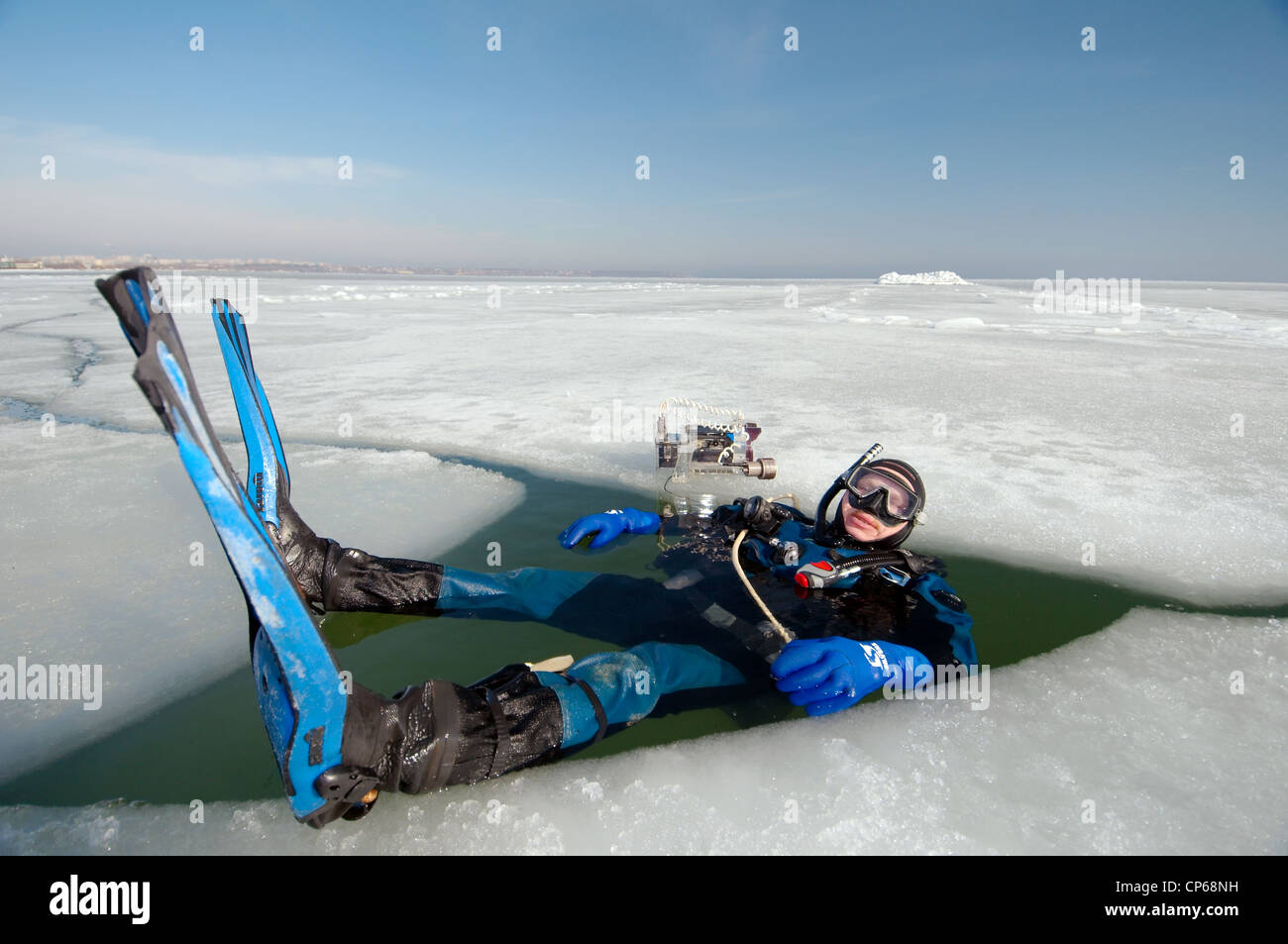 Diver, subglacial diving, ice diving, in the frozen Black Sea, a rare ...