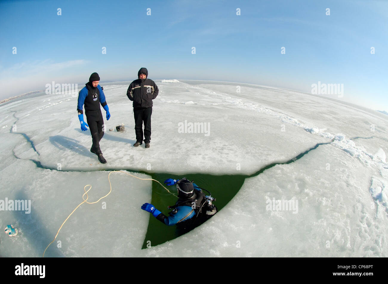 Divers, subglacial diving, ice diving, in the frozen Black Sea, a rare ...