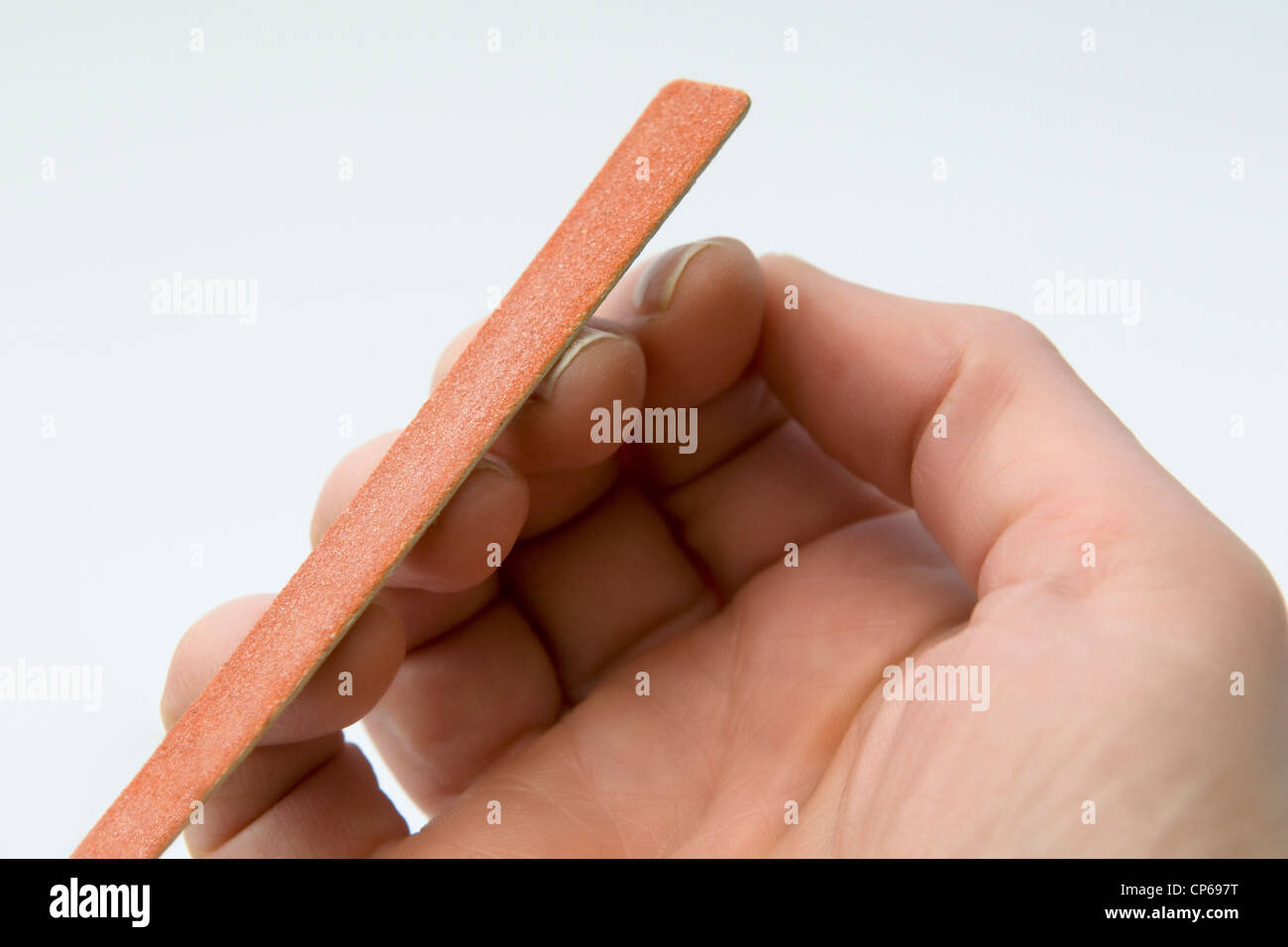 Hand shot of Caucasian woman filing nails Stock Photo - Alamy