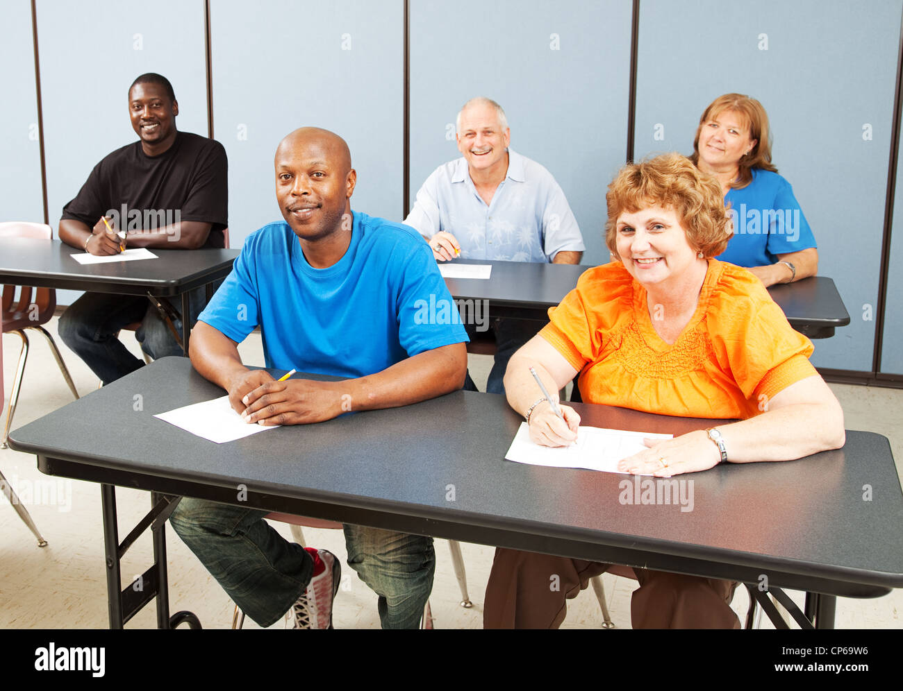 Diverse adult education class, various ages and ethnicities, smiling ...