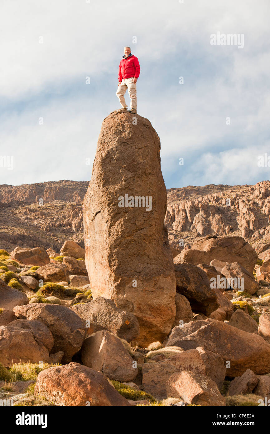 A climber on an exposed pinnacle in the Jebel Sirwa region of the Anti ...