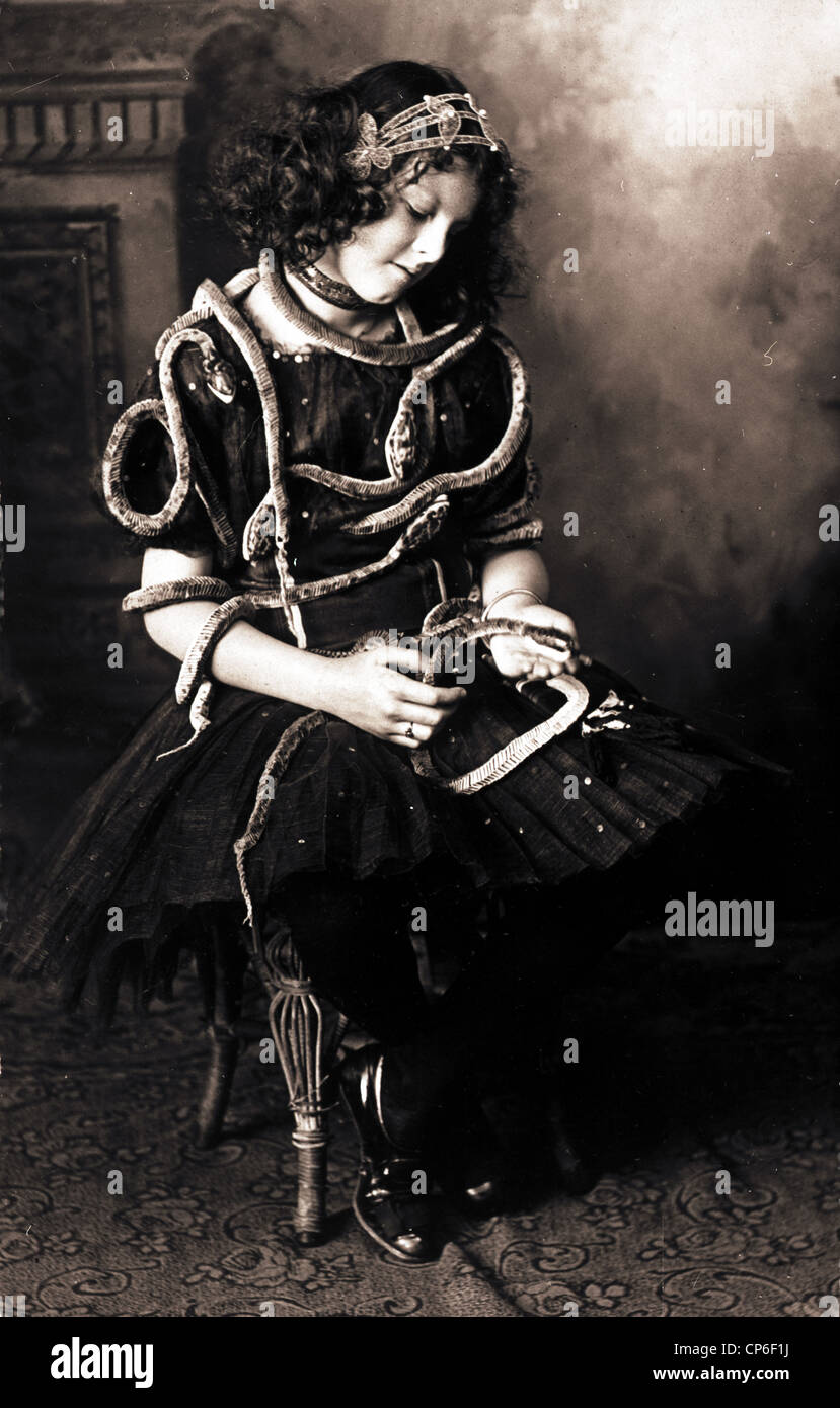 Pretty Girl Surrounded by Fake Snakes Stock Photo - Alamy