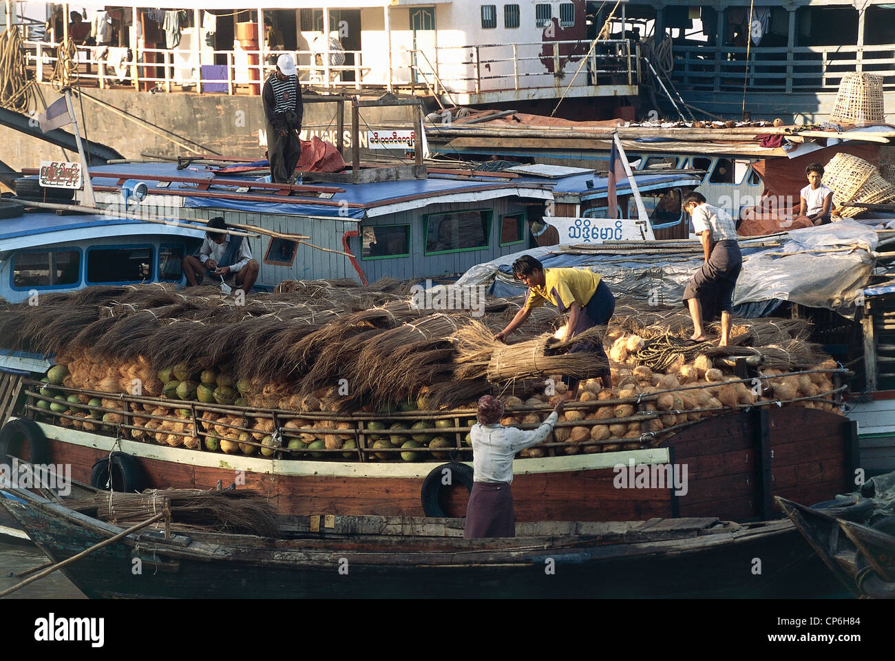 Myanmar (Burma) - Yangon (Rangoon), the cargo port. Transport coconuts ...