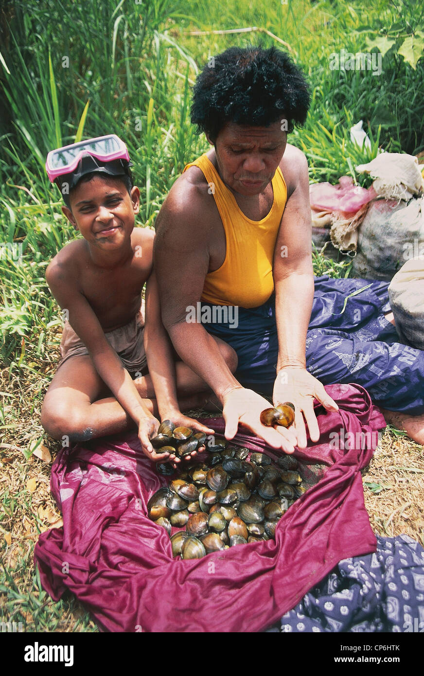 Fiji - Viti Levu Island - Sigatoka Valley. Woman and child with freshly ...