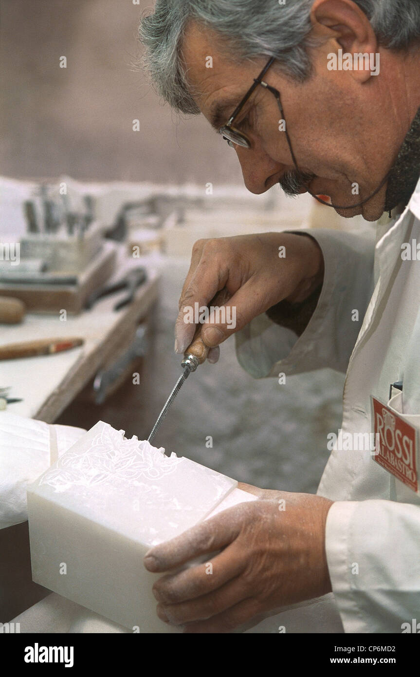 Tuscany - Volterra (PI), a Rossi. Craftsman works a block of alabaster ...