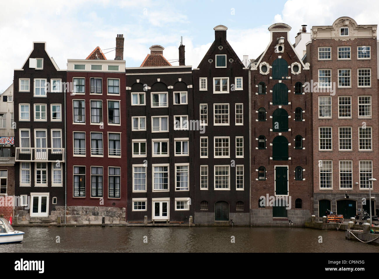 Traditional canal side houses Amsterdam Holland Netherlands Europe EU ...