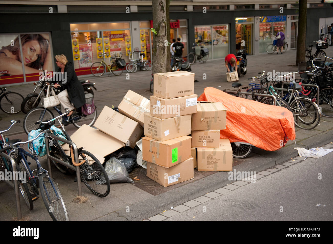 Rubbish Cardboard boxes stacked on pavement Amsterdam Holland ...