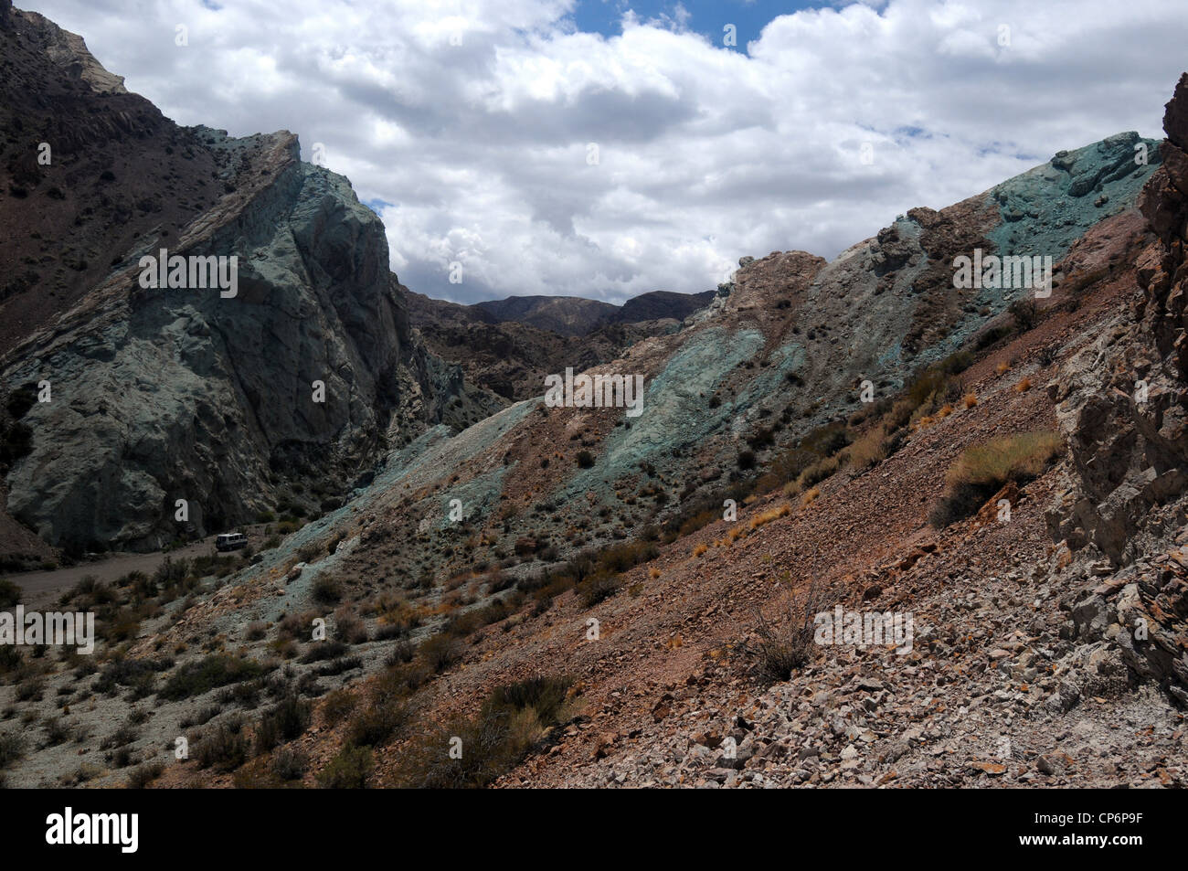 Bizarre landscape of the Seven-coloured Hills region dwarfing vehicle ...