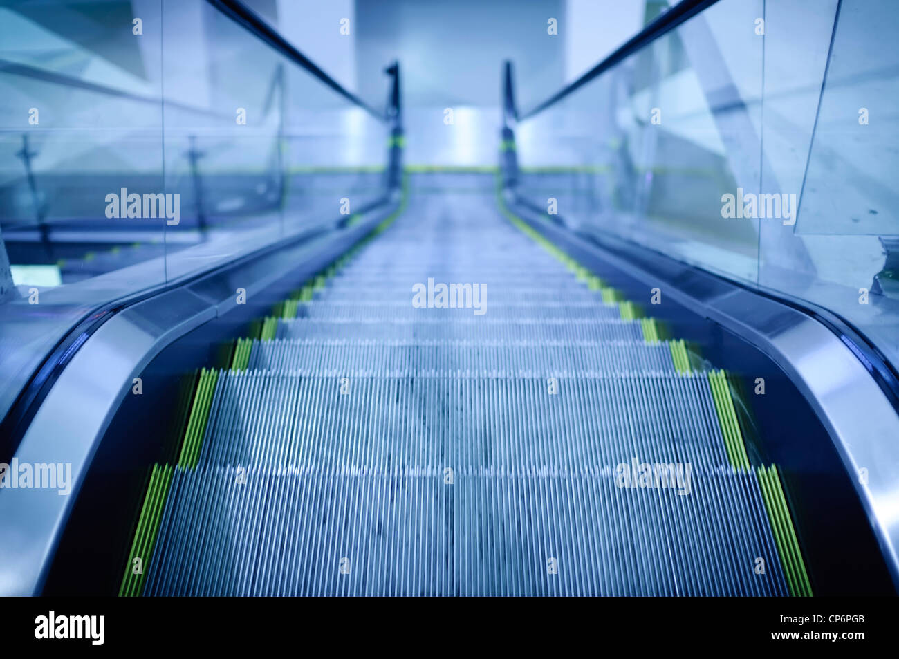 Escalator with blue toned color Stock Photo - Alamy