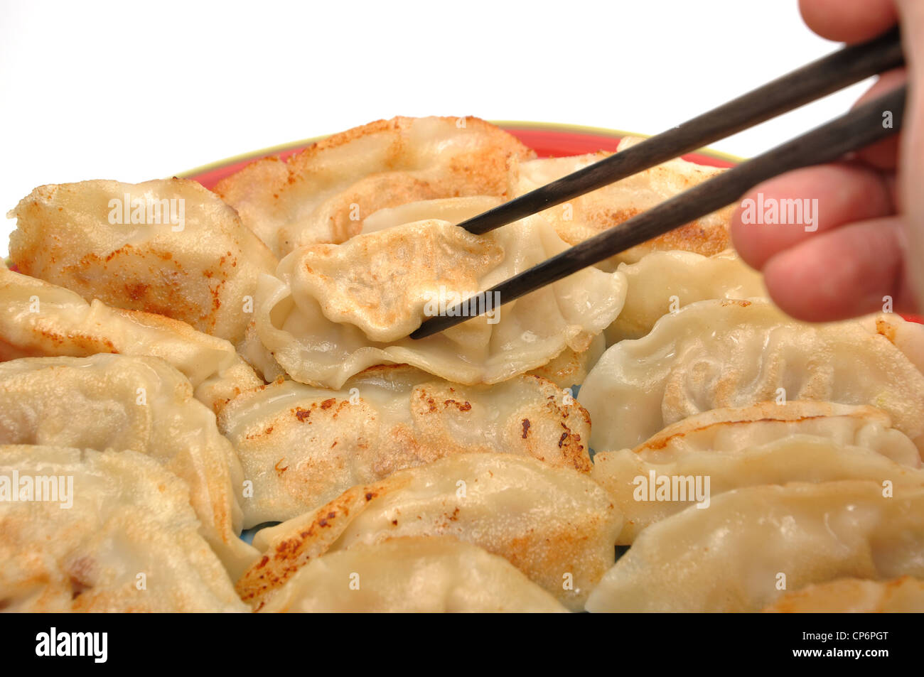 Eating fired chinese dumpling Stock Photo - Alamy