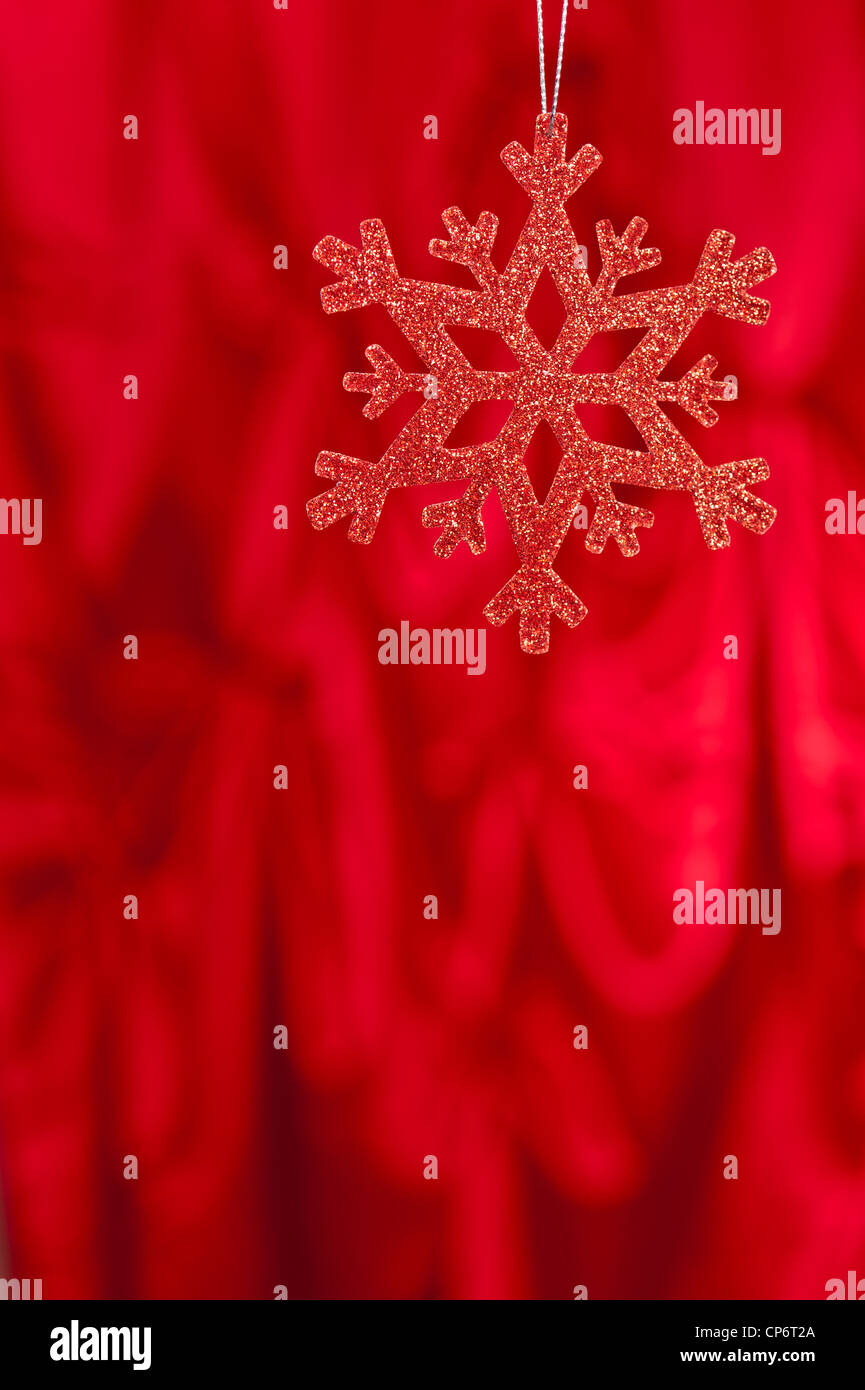 Red snow flake on a red background for Christmas Stock Photo - Alamy