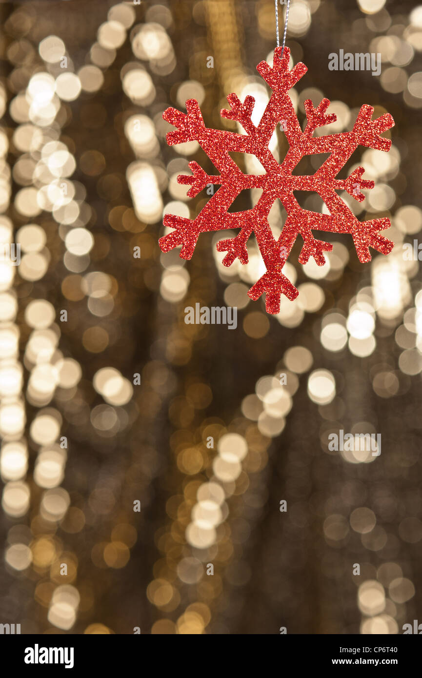 Red snow flake on a gold glitter background for Christmas Stock Photo ...