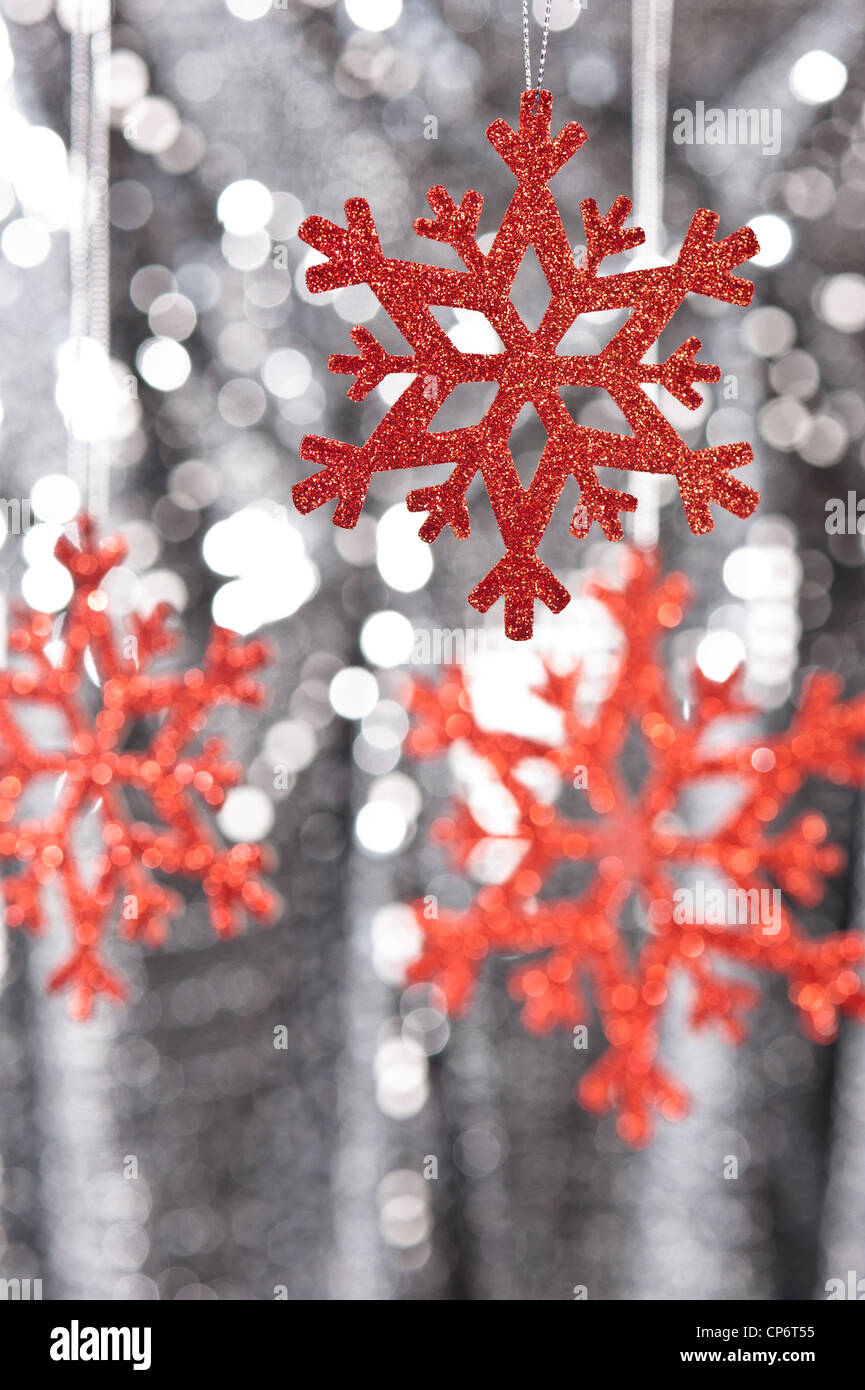 Red snow flake on a silver glitter background for Christmas Stock Photo ...