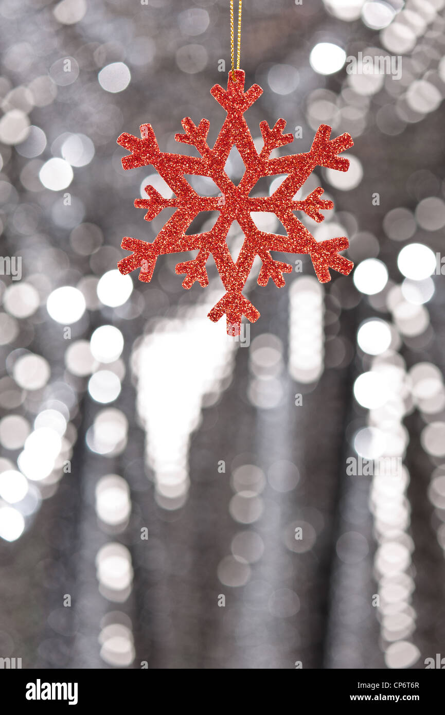 Red snow flake on a silver glitter background for Christmas Stock Photo ...