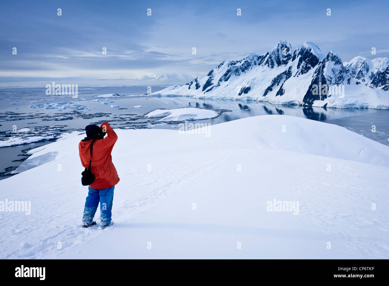 man makes a picture of mountains in Antarctica Stock Photo - Alamy