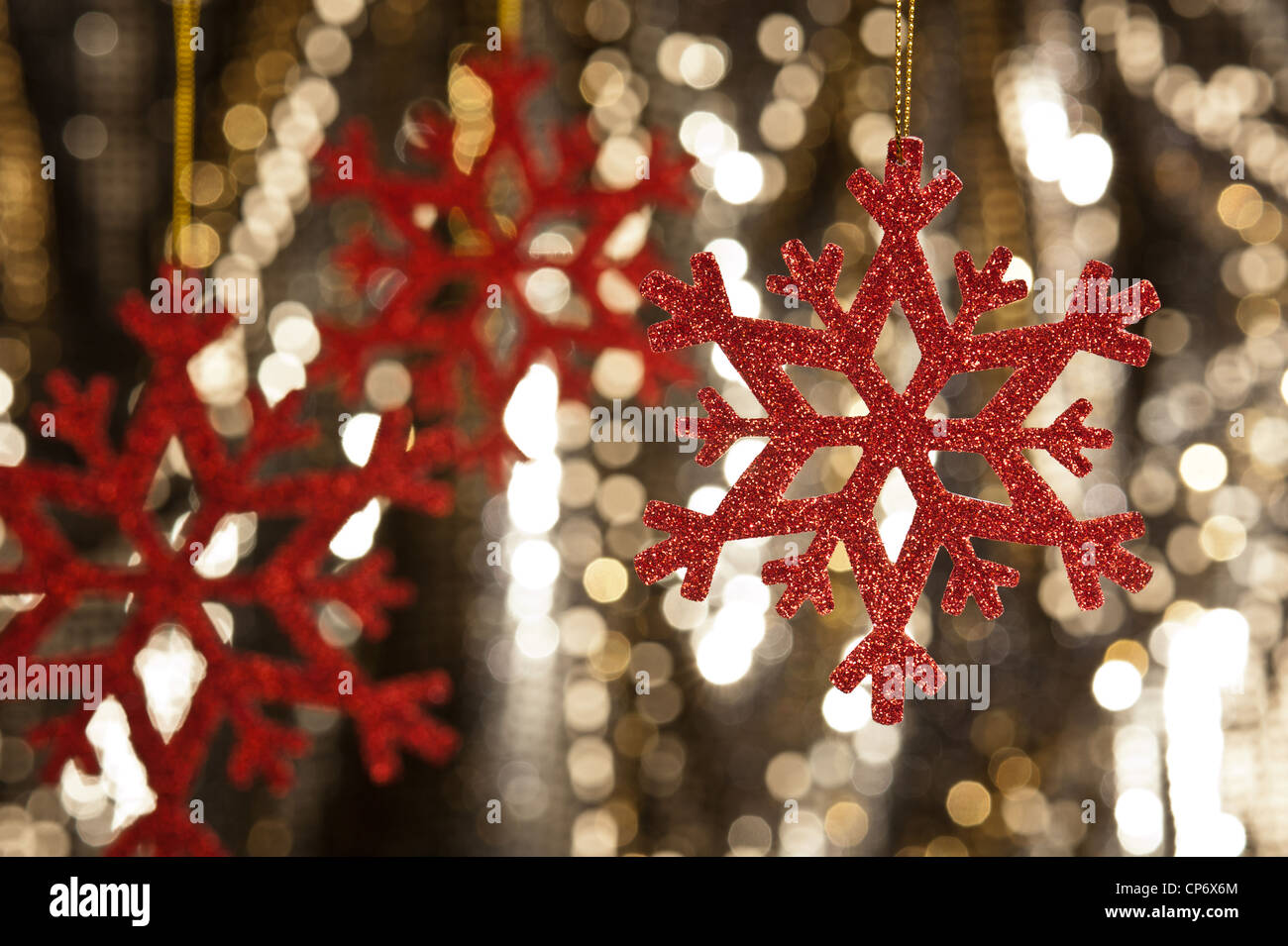 Red snow flake on a gold glitter background for Christmas Stock Photo ...