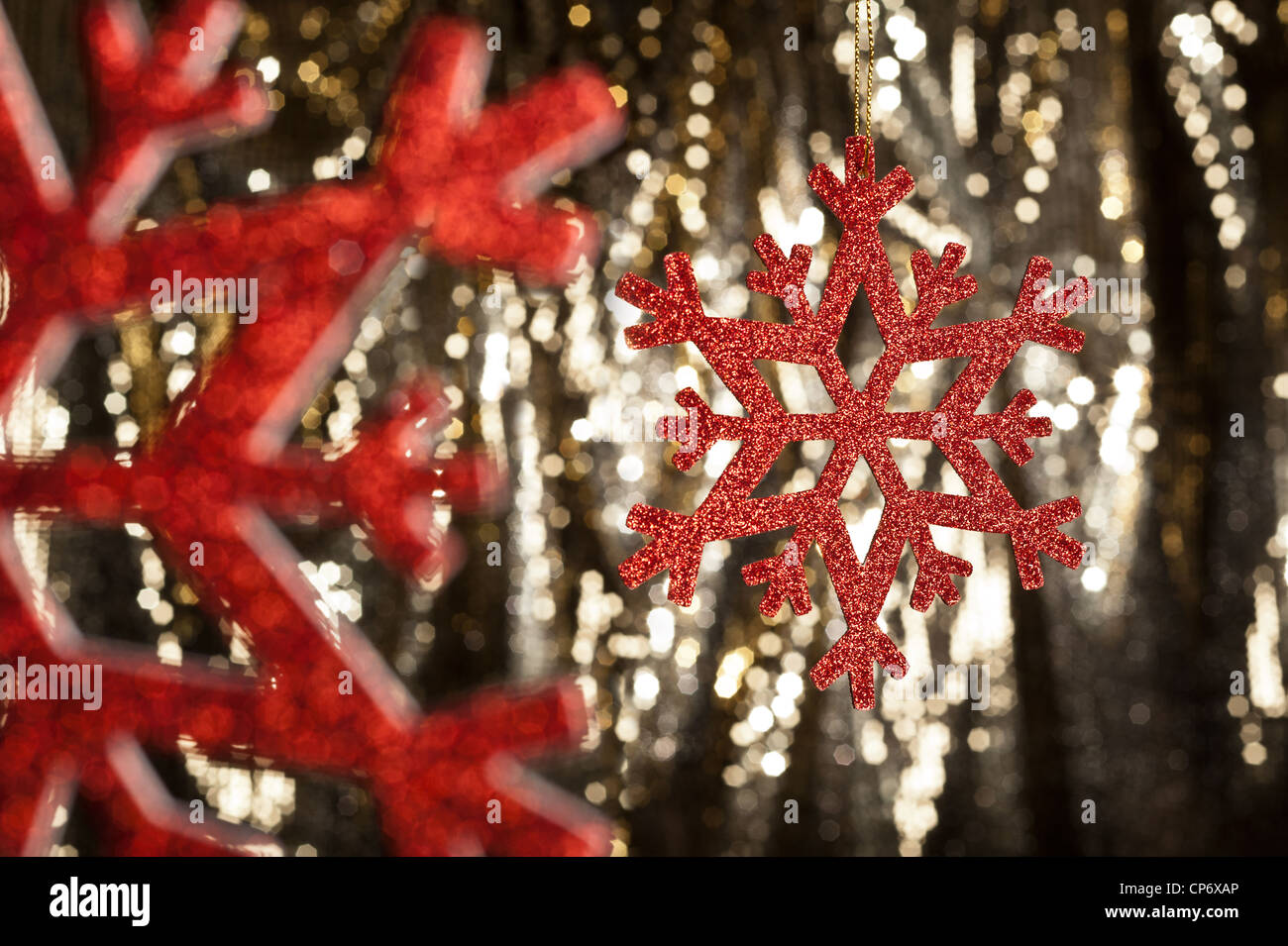 Red snow flake on a gold glitter background for Christmas Stock Photo ...