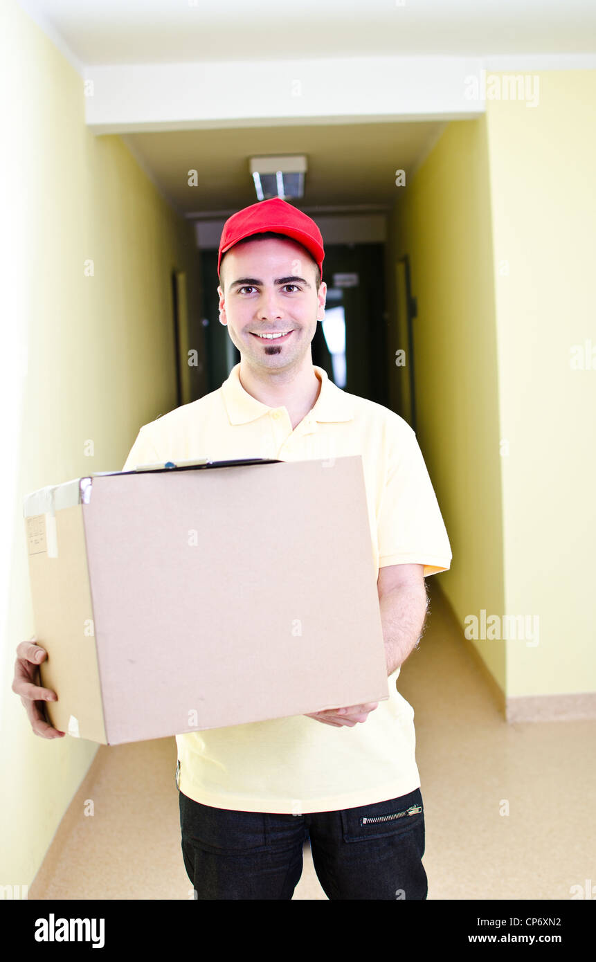 Your handsome delivery man during his work Stock Photo - Alamy