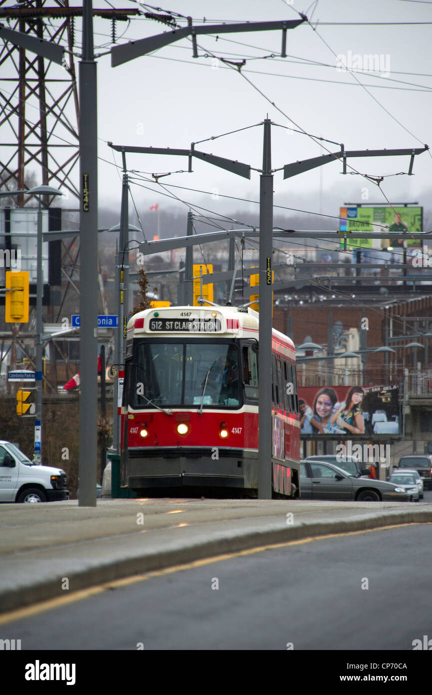 Toronto street car riding on St. Clair Street Stock Photo - Alamy