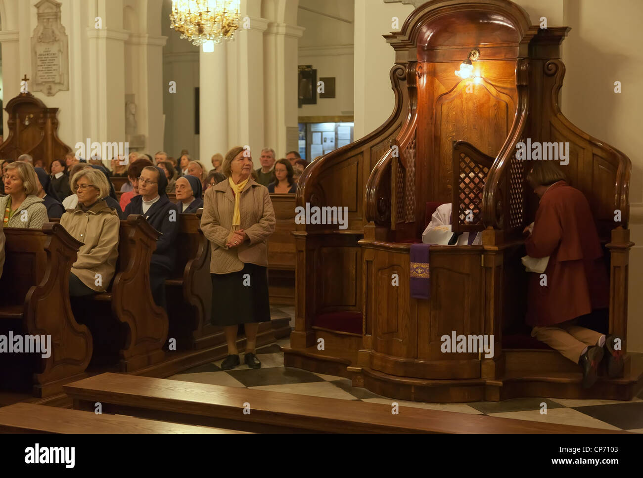 Confession in the Church of the Holy Cross, Warsaw, Poland Stock Photo ...