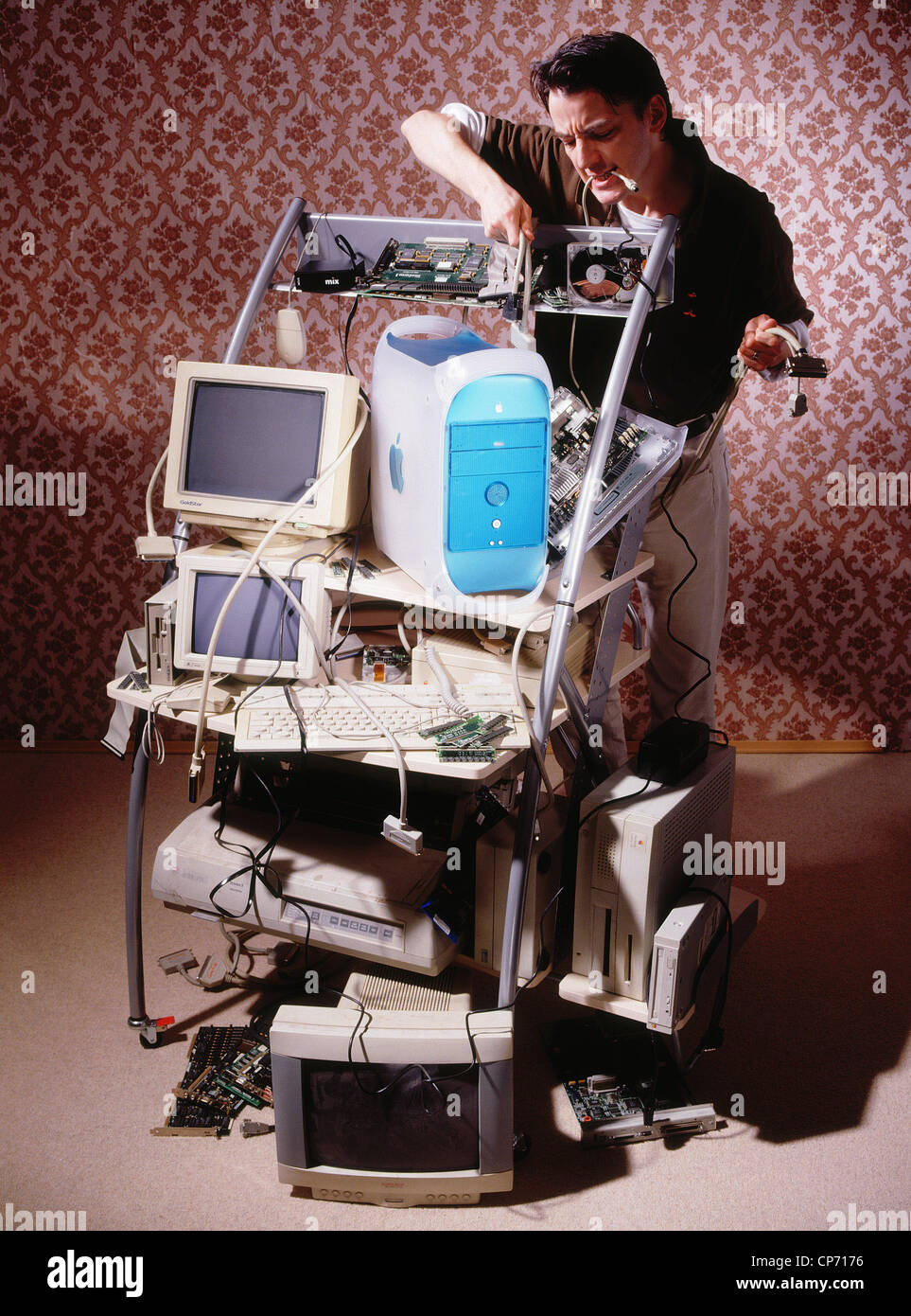 Man trying to repair a computer Stock Photo - Alamy