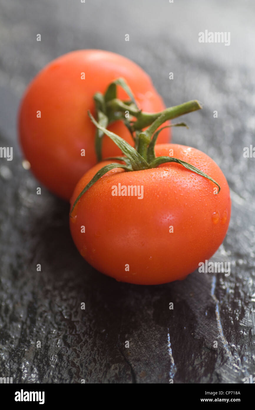 A photograph of some fresh red vine tomatoes Stock Photo - Alamy